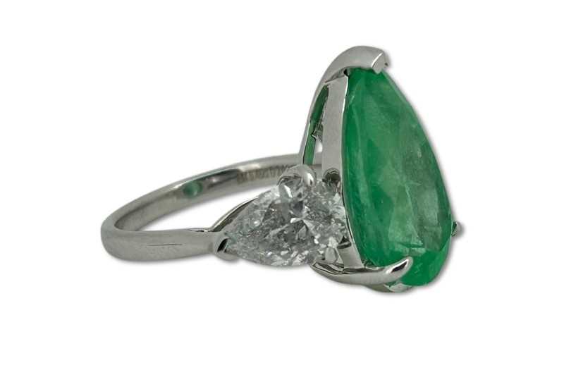 Lot 253 - Pear Shaped Emerald and Diamond Ring.